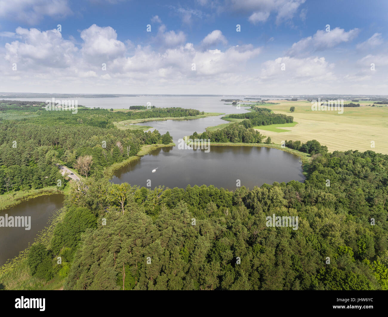 Aerial view of green islands and clouds at summer sunny morning ...