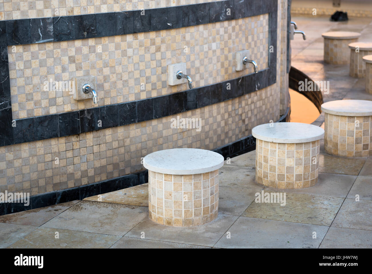 Ablution taps where worshippers wash their feet before prayer time in ...
