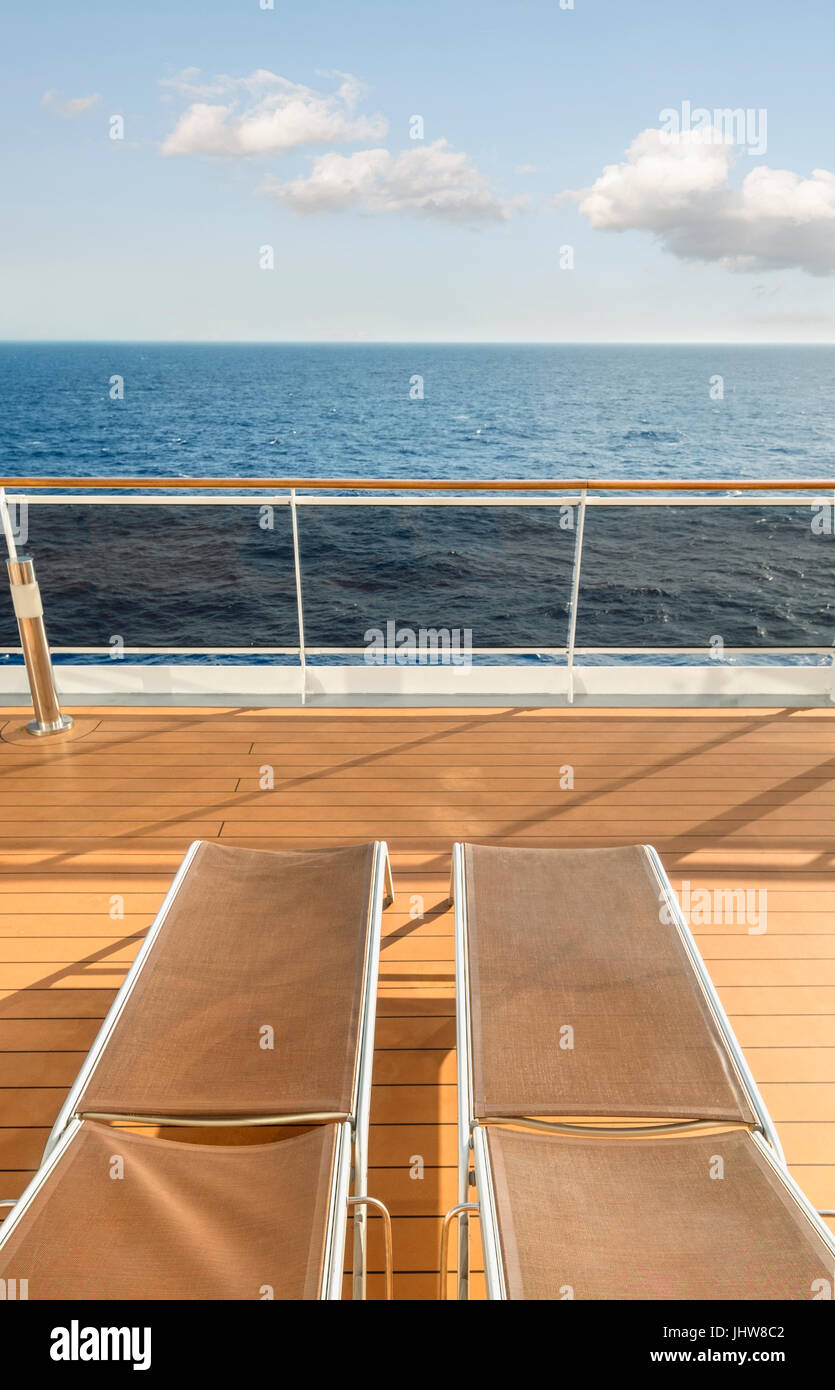 Cruise ship deck with sun loungers out at sea Stock Photo - Alamy
