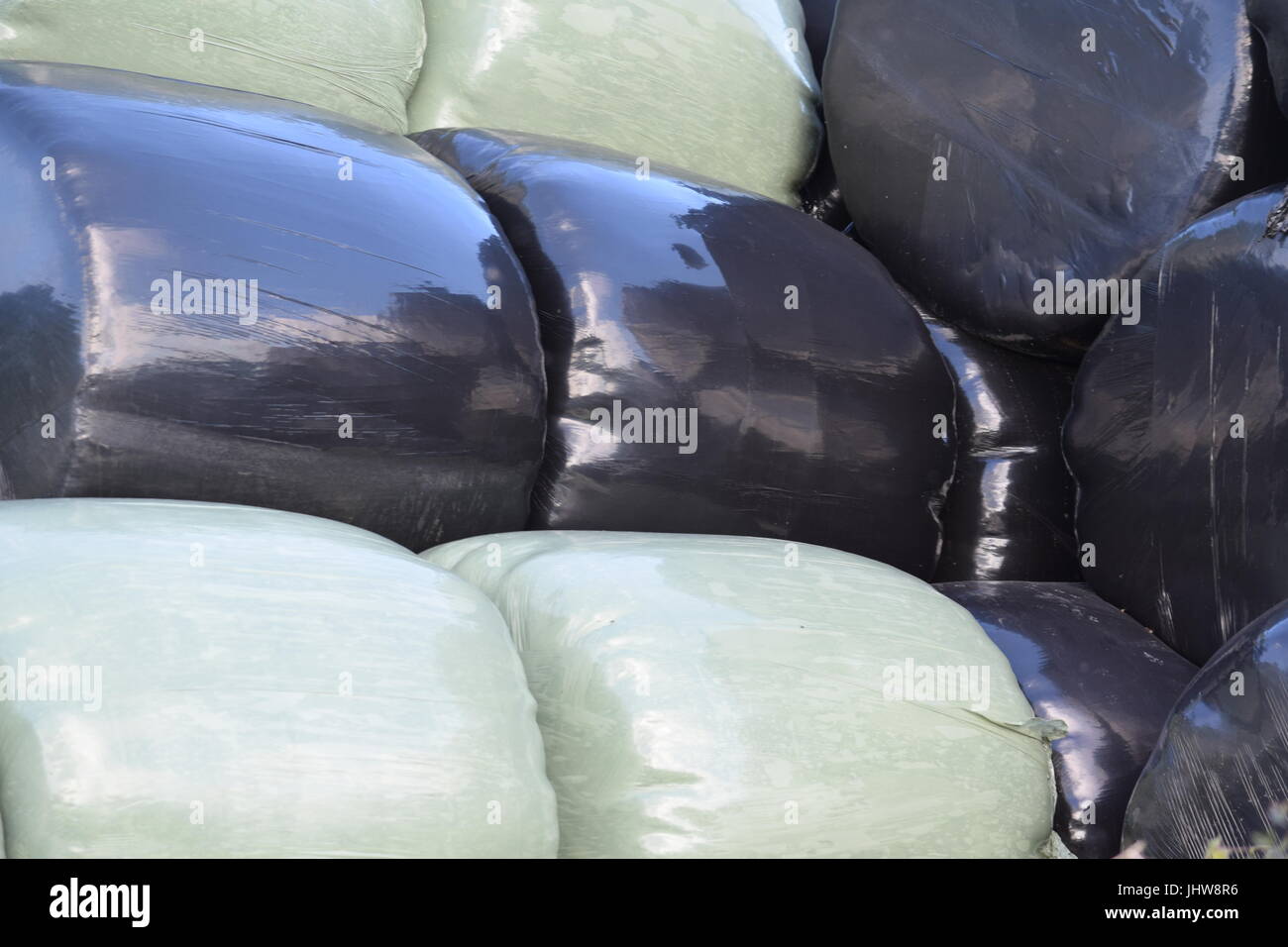 Black plastic wrapped silage Stock Photo - Alamy