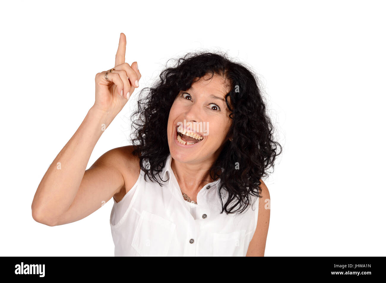 Portrait of beautiful woman pointing up. Isolated white background ...