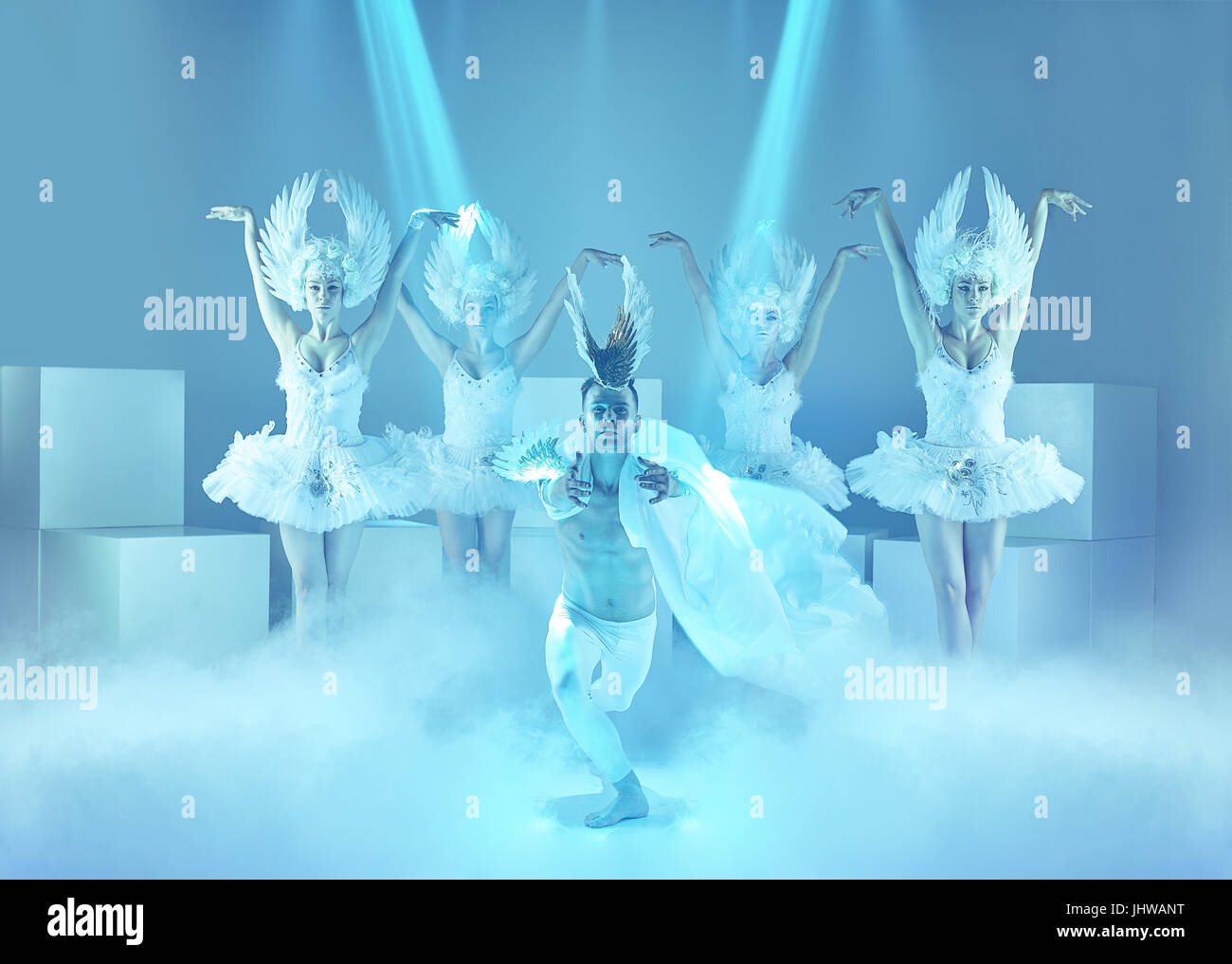 The studio shot of group of modern dancers on blue background Stock ...