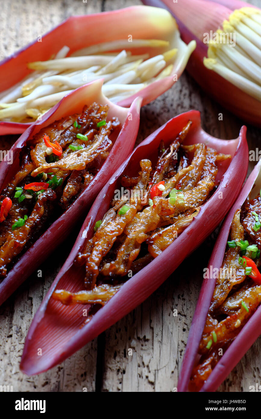 Vegetarian food processing from banana flower, roll young banana fruit ...