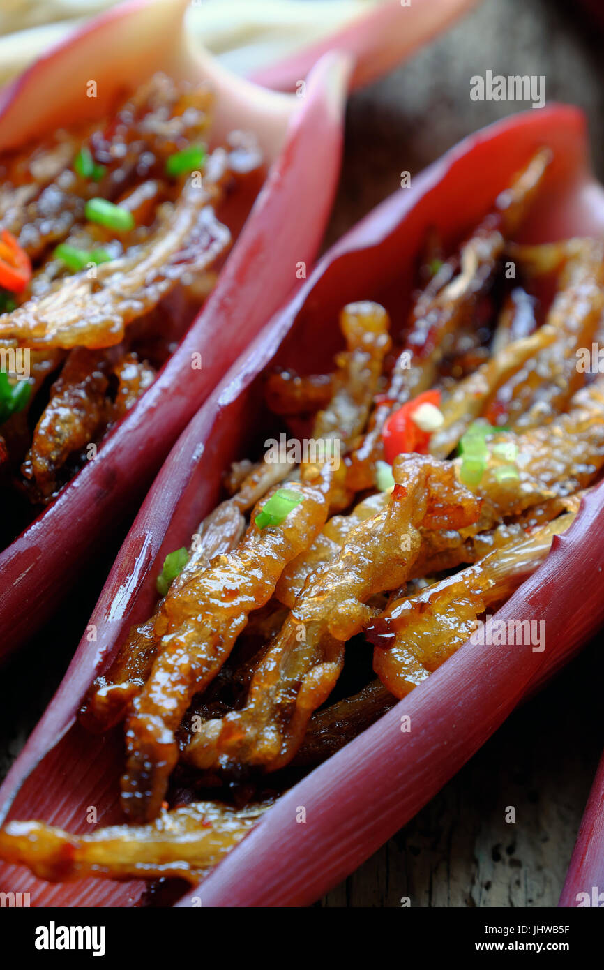 Vegetarian food processing from banana flower, roll young banana fruit ...