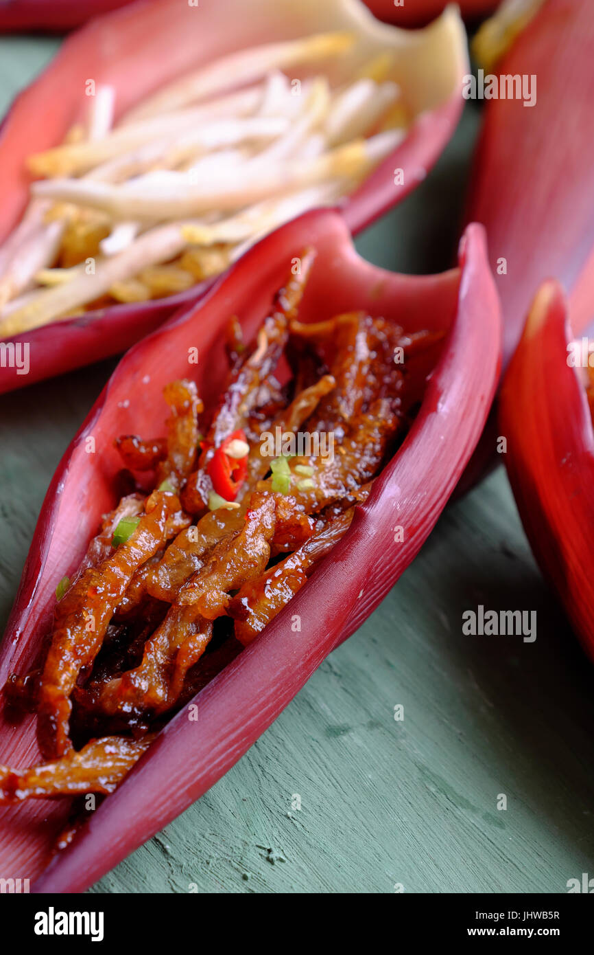 Vegetarian food processing from banana flower, roll young banana fruit ...