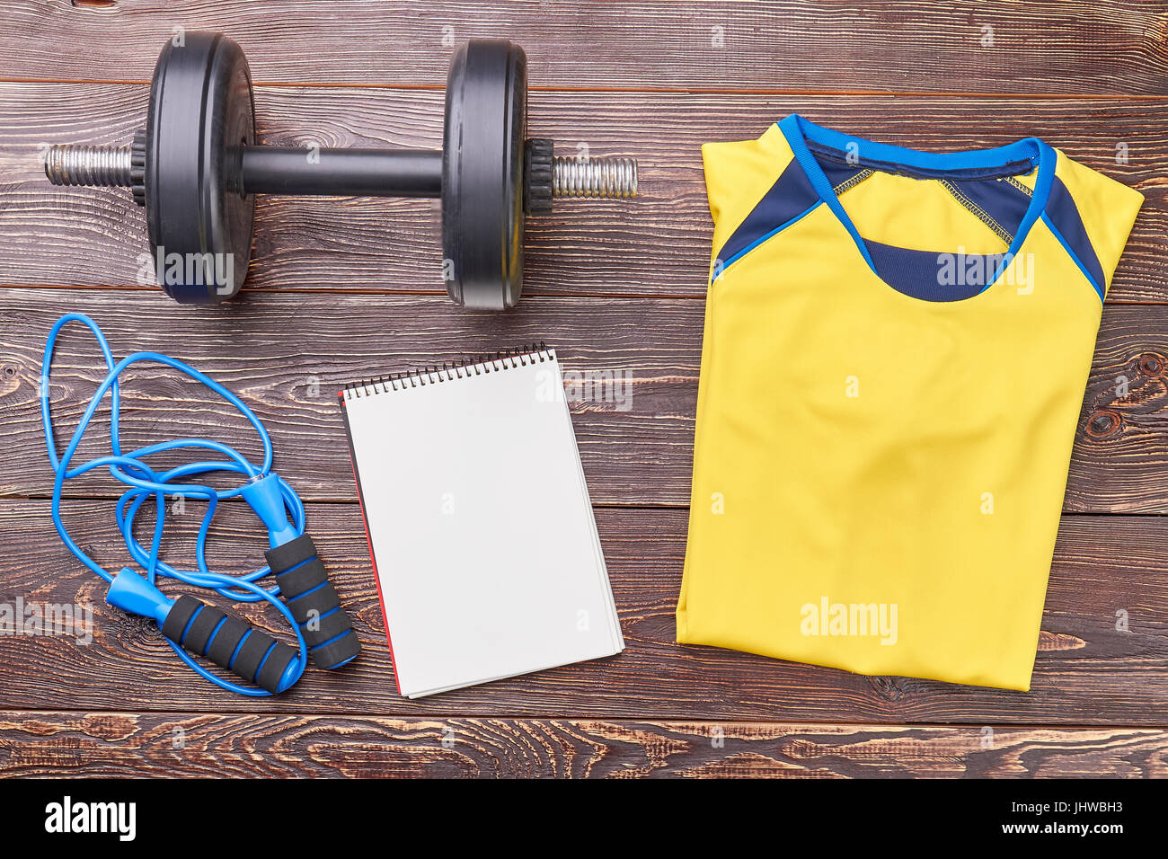 Jumping rope, dumbbell, notebook, t-shirt Stock Photo - Alamy