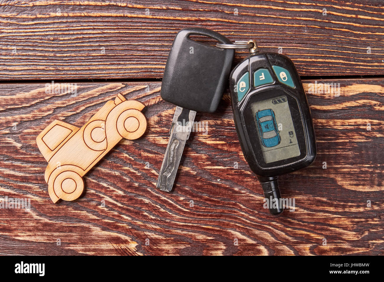 Cardboard car, key, wooden table Stock Photo - Alamy