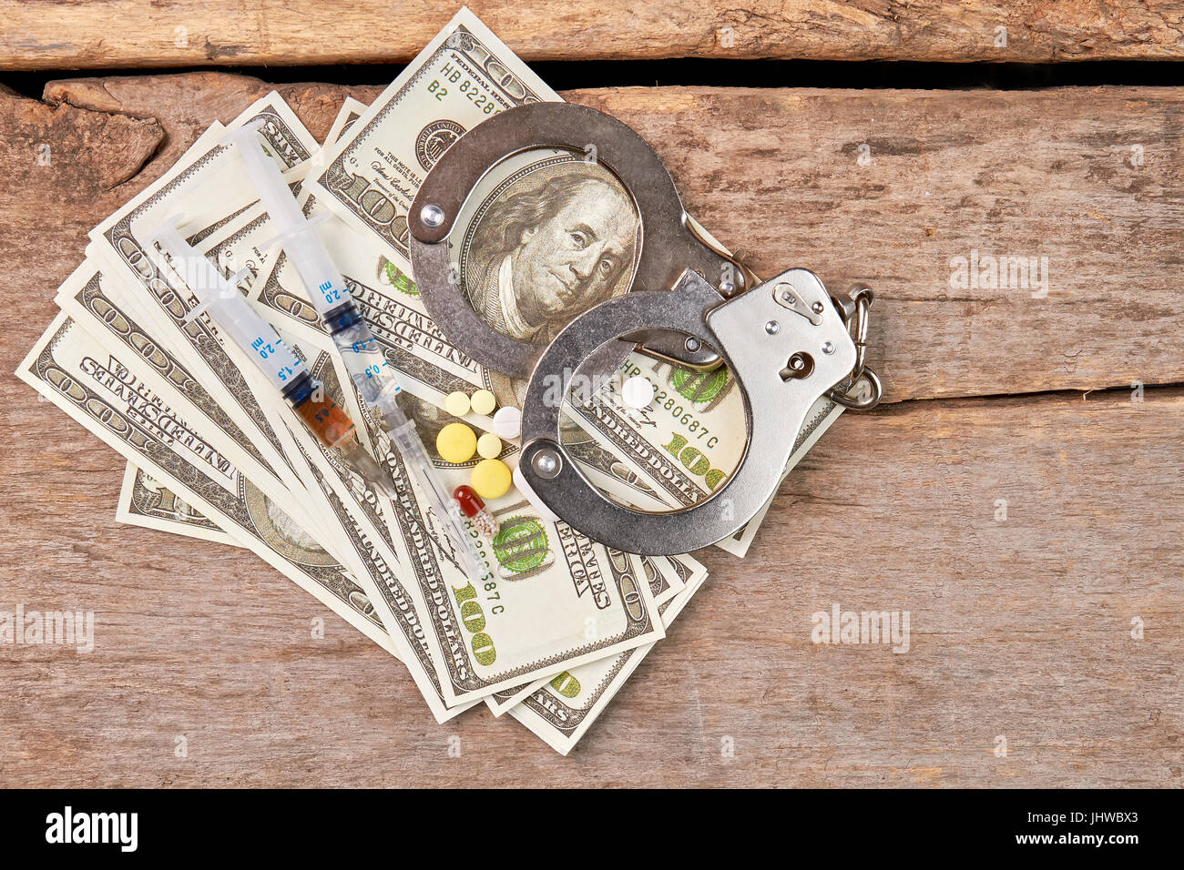 Cash, narcotics, handcuffs, top view Stock Photo - Alamy