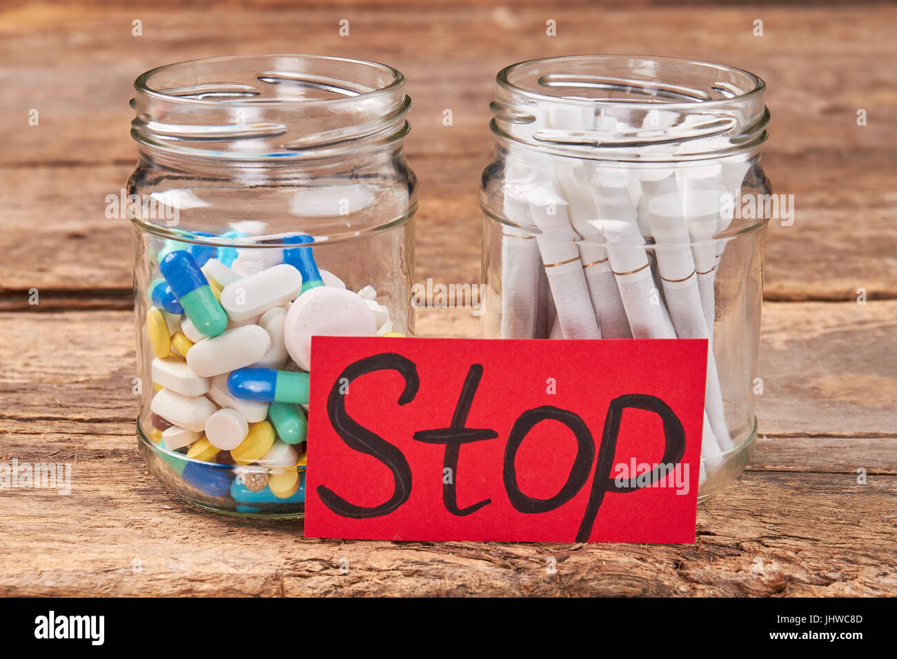 Pills, tobacco cigarettes, message stop Stock Photo - Alamy