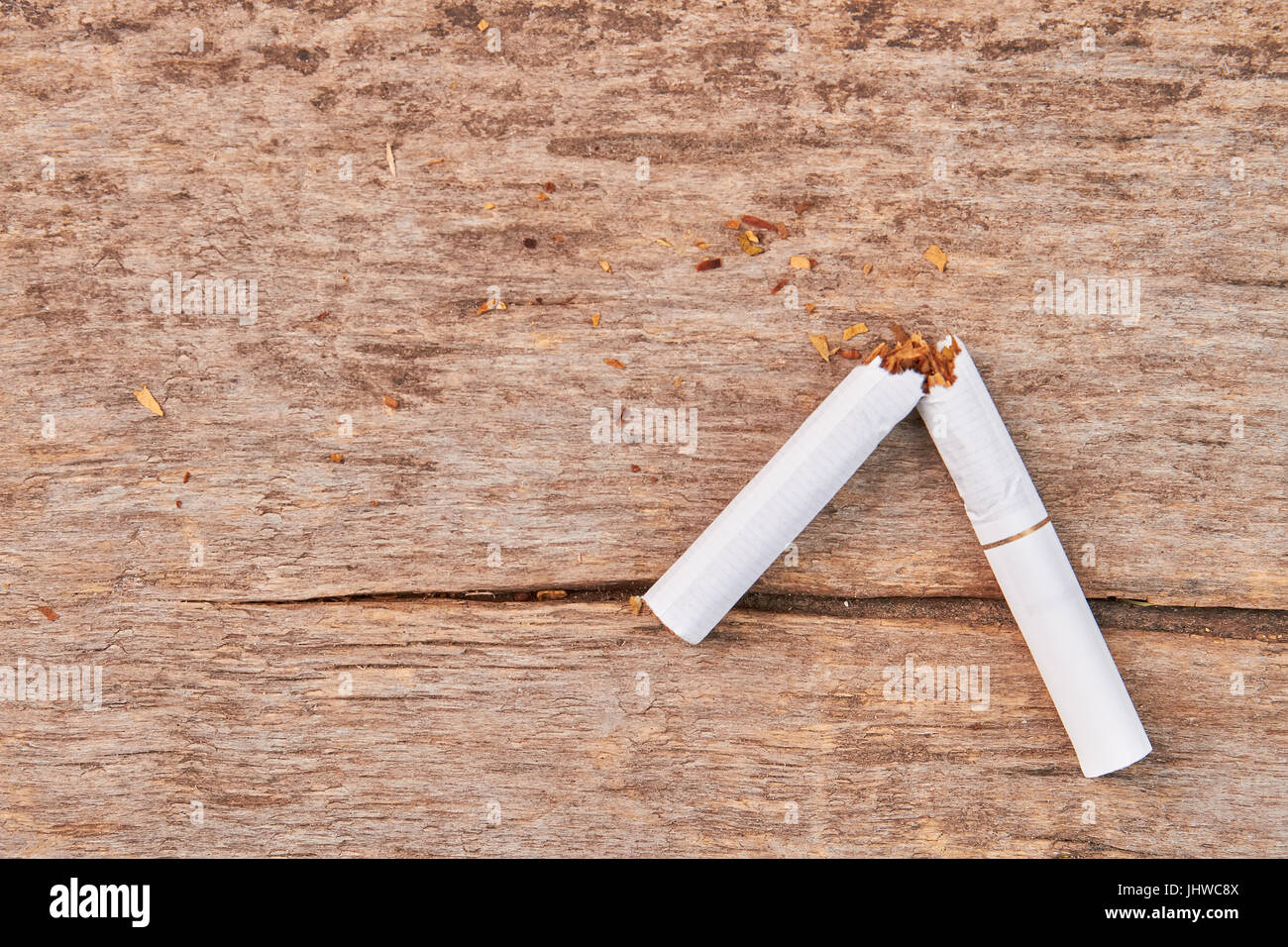 Broken tobacco cigarette Stock Photo - Alamy