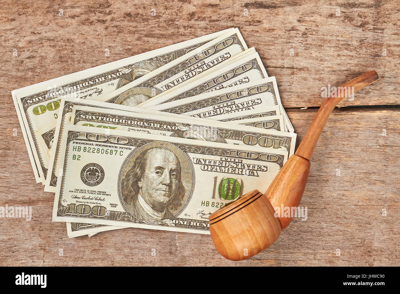 American money, wooden pipe for smoking Stock Photo - Alamy