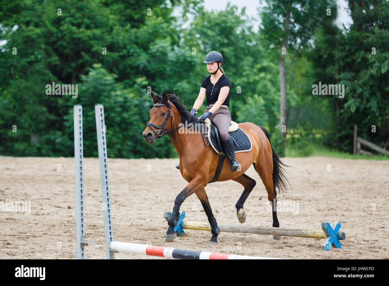 Riding in outside arena hi-res stock photography and images - Alamy