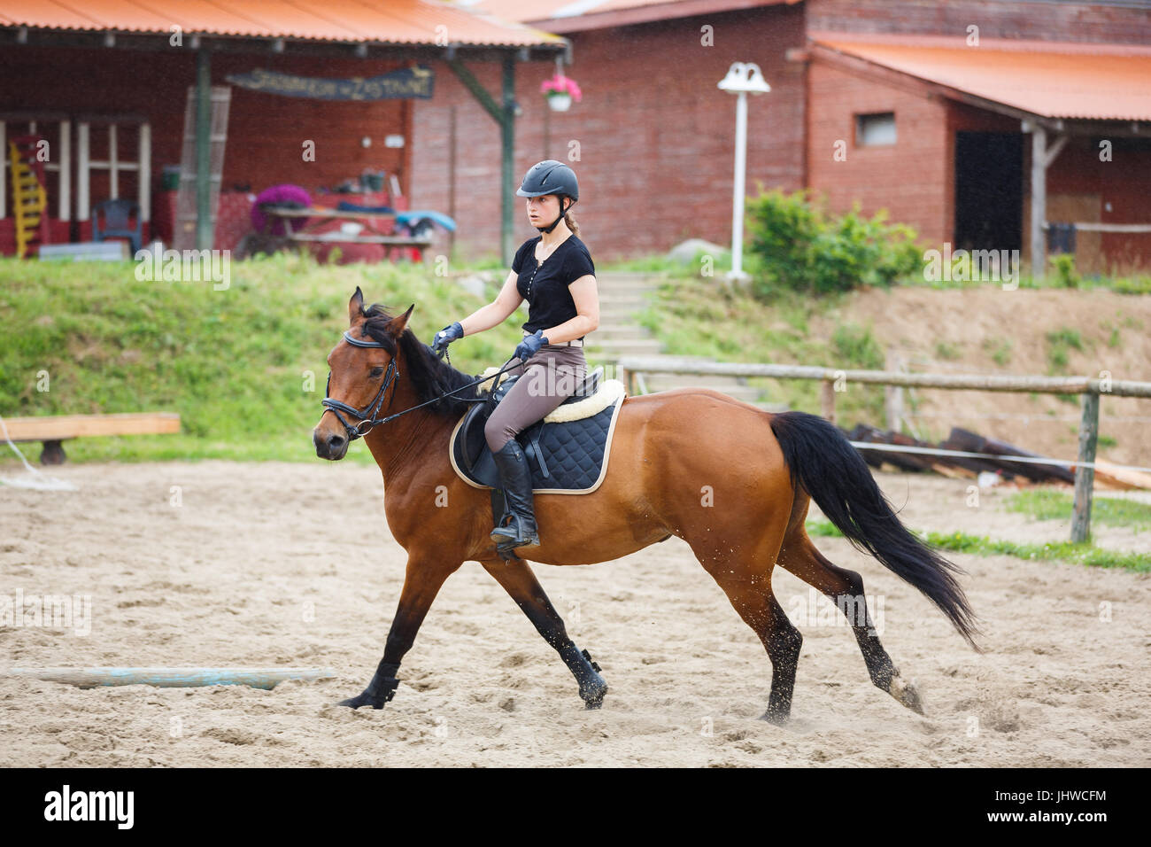 Riding in outside arena hi-res stock photography and images - Alamy
