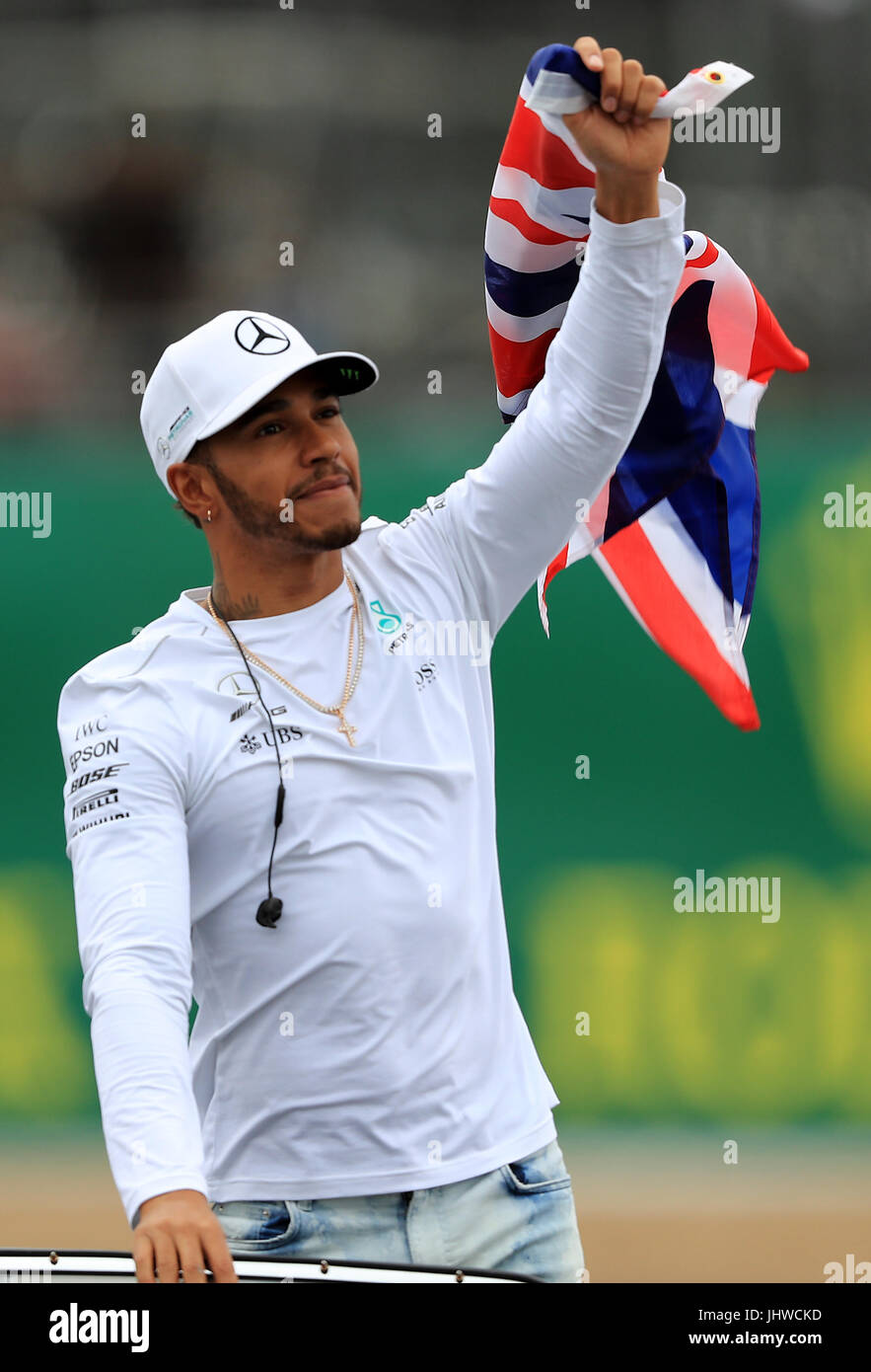 Mercedes' Lewis Hamilton waves to the crowd during the drivers parade ...