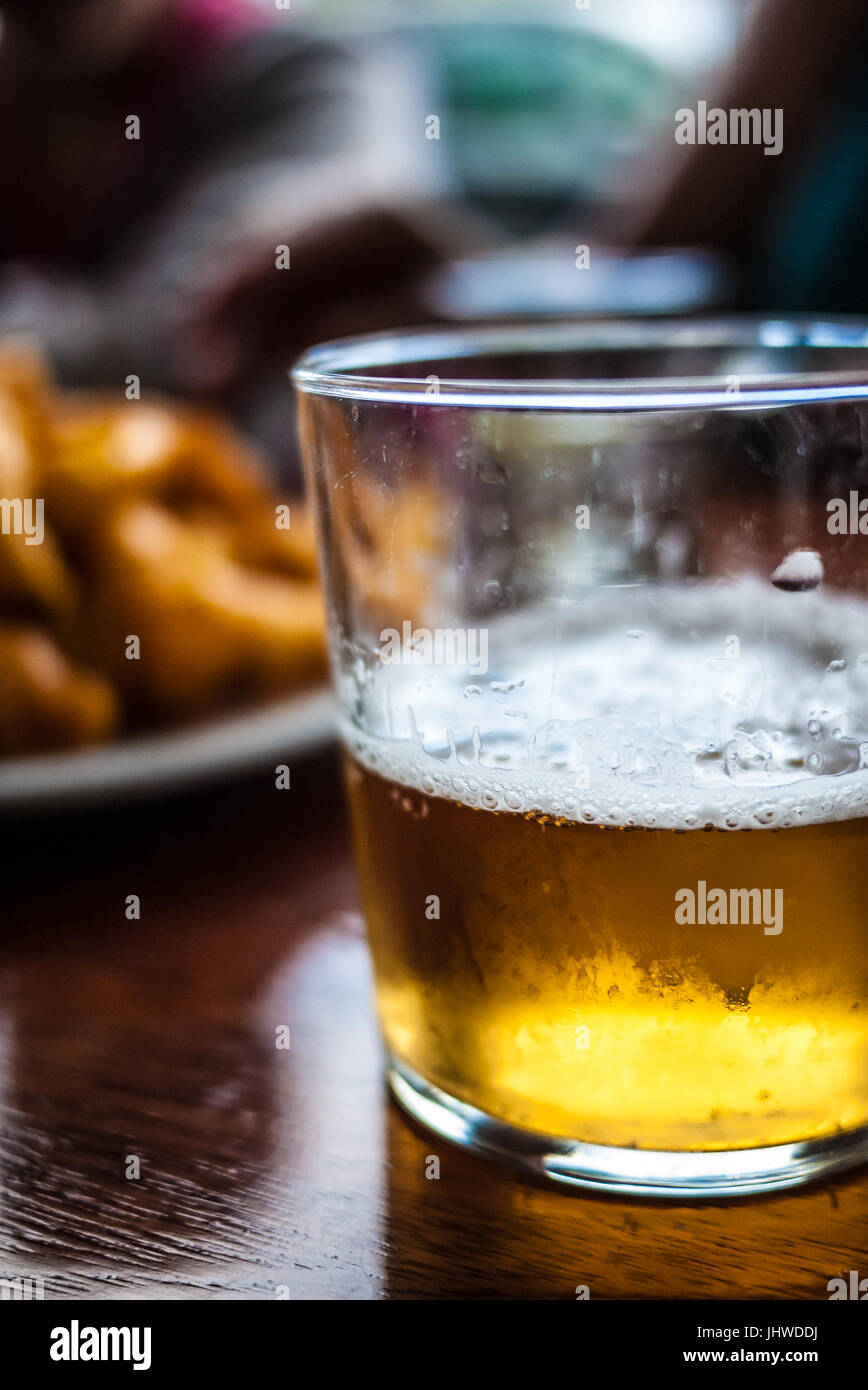 Typical basque appetizer in plate with a beer, squid raisins Stock ...
