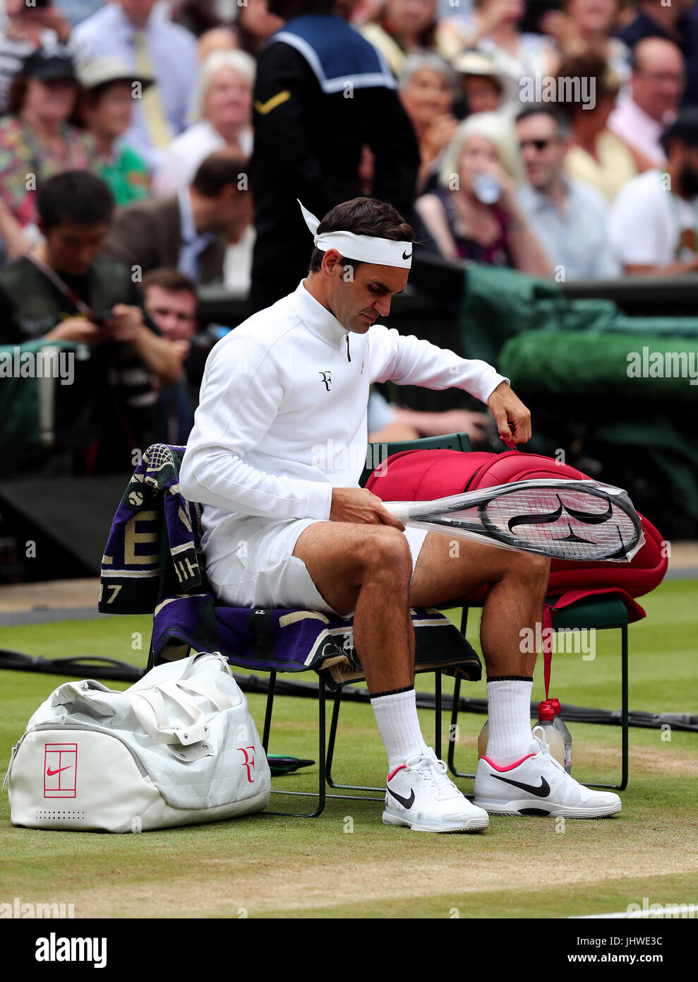 Roger Federer unpacks his racquets ahead of the Gentlemen's Singles ...