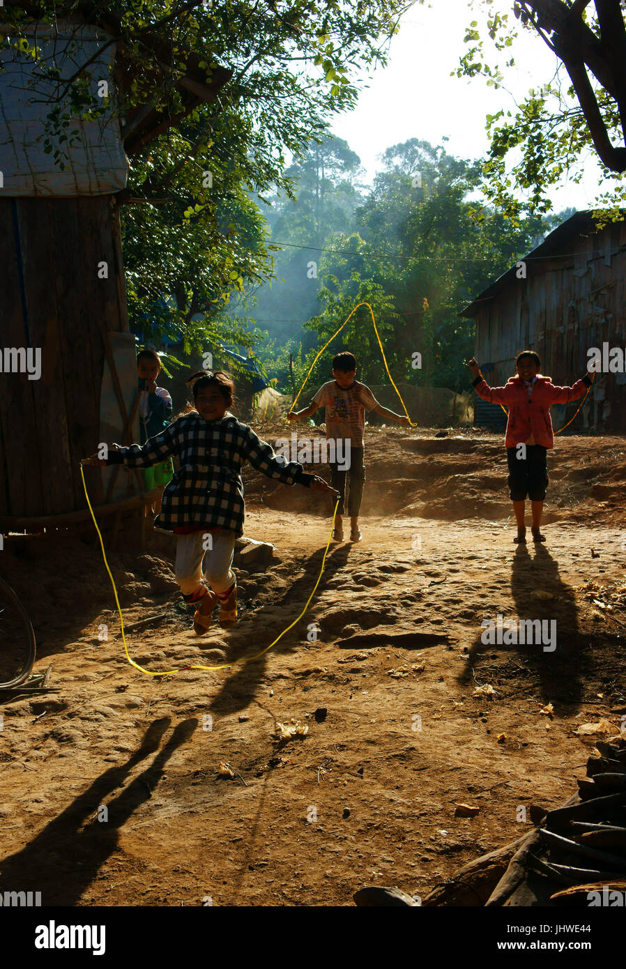 Children jumping rope hi-res stock photography and images - Alamy