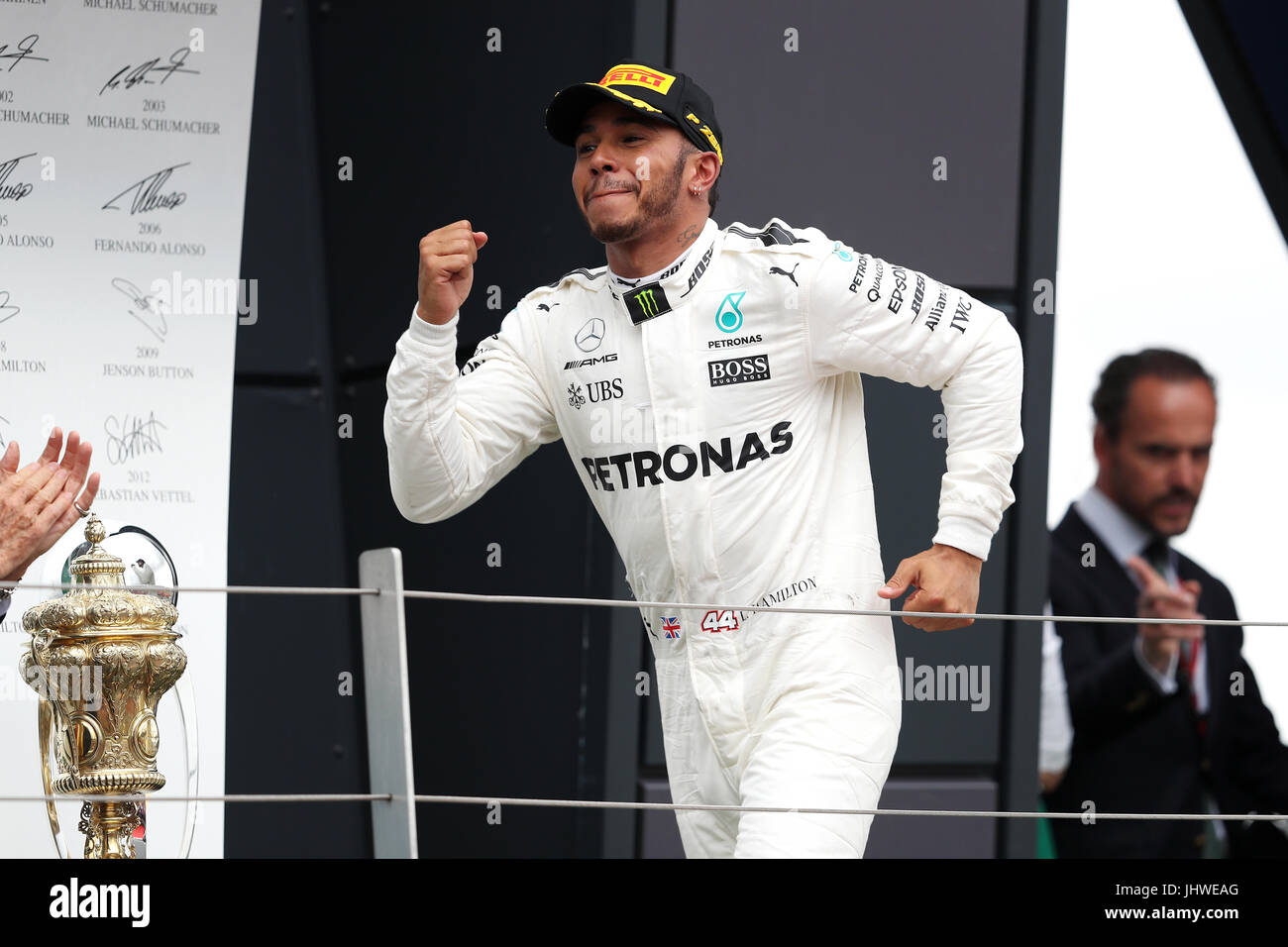 Mercedes' Lewis Hamilton celebrates victory on the podium after the ...