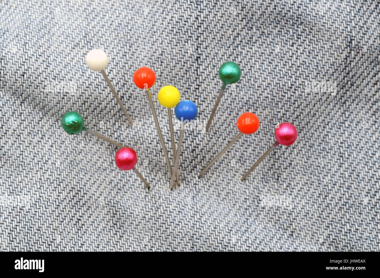 colored pins in textile jeans Stock Photo - Alamy