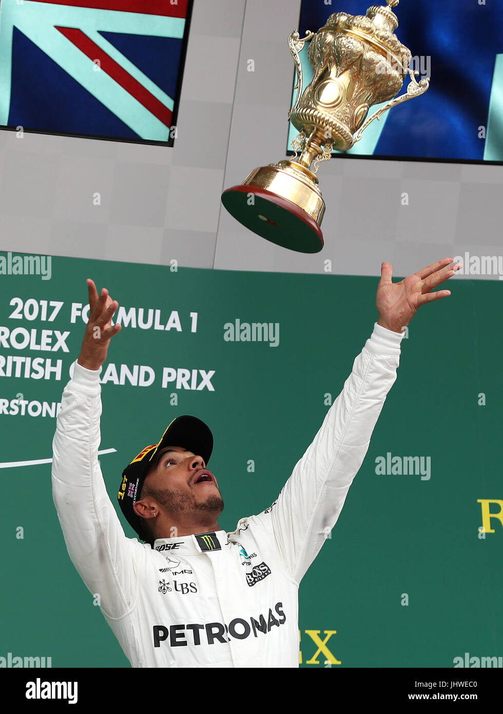 Mercedes' Lewis Hamilton celebrates victory on the podium after the ...