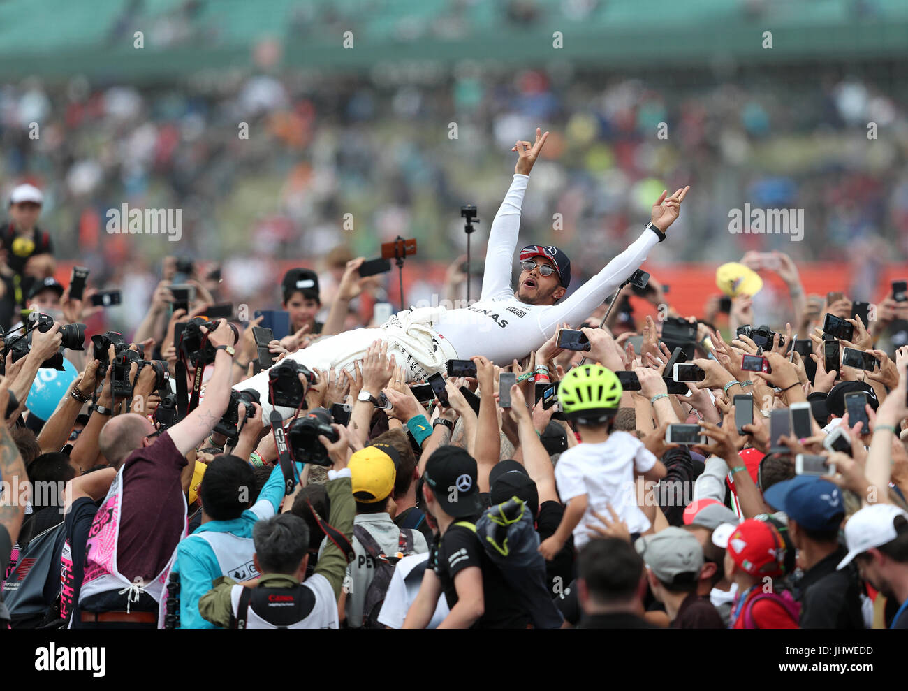 Mercedes' Lewis Hamilton celebrates in the crowd after the 2017 British ...