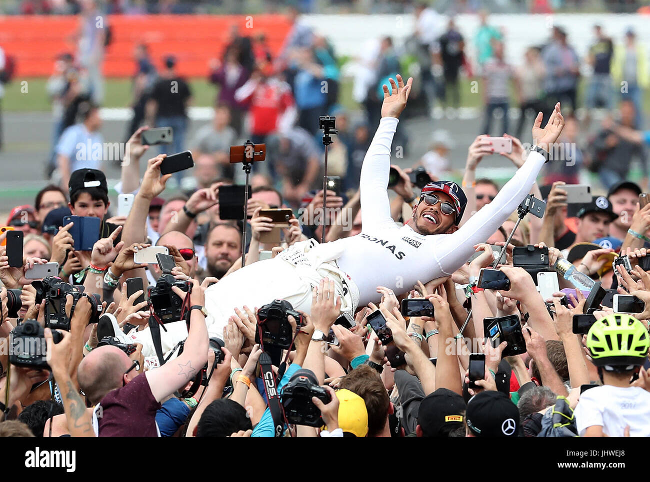 Mercedes' Lewis Hamilton celebrates his victory with the crowd during ...