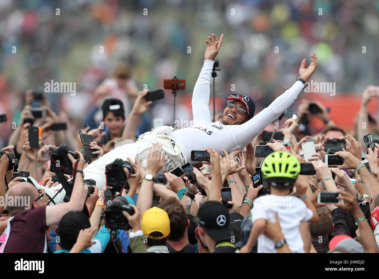 Mercedes' Lewis Hamilton celebrates in the crowd after the 2017 British ...