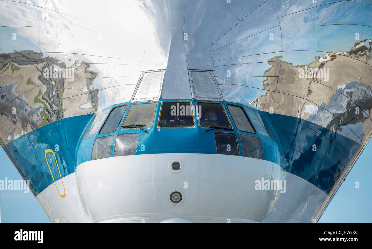 NASA pilots sit in the cockpit of a B-377 Super Guppy cargo freighter ...