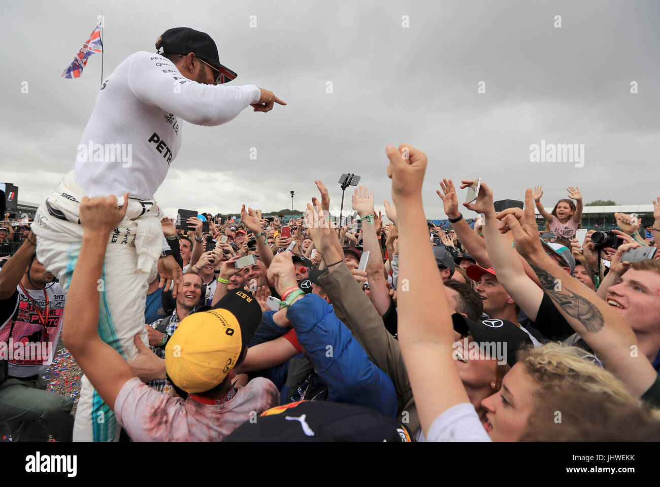 Mercedes' Lewis Hamilton celebrates his victory with the crowd during ...