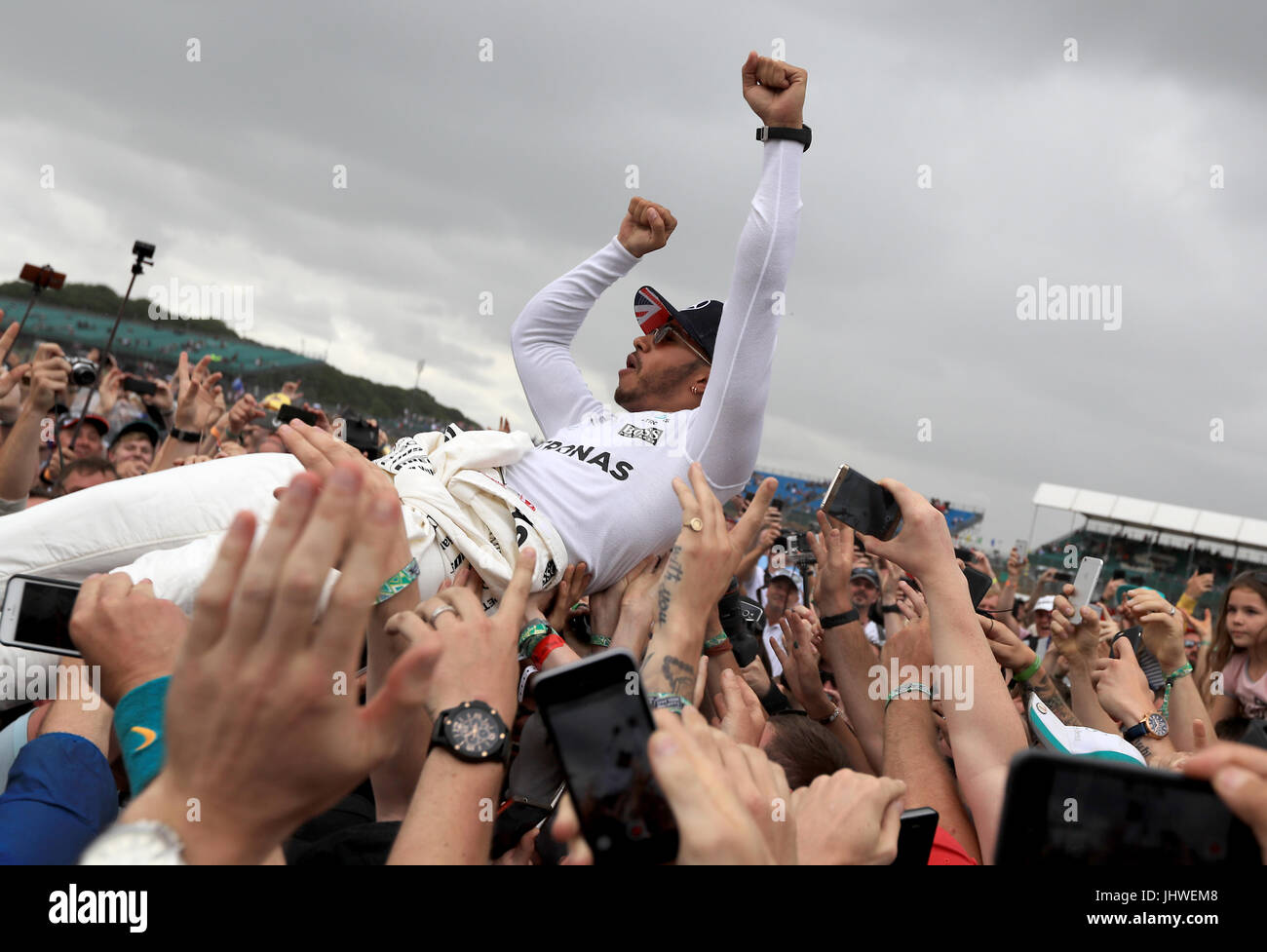 Mercedes' Lewis Hamilton celebrates his victory with the crowd during ...