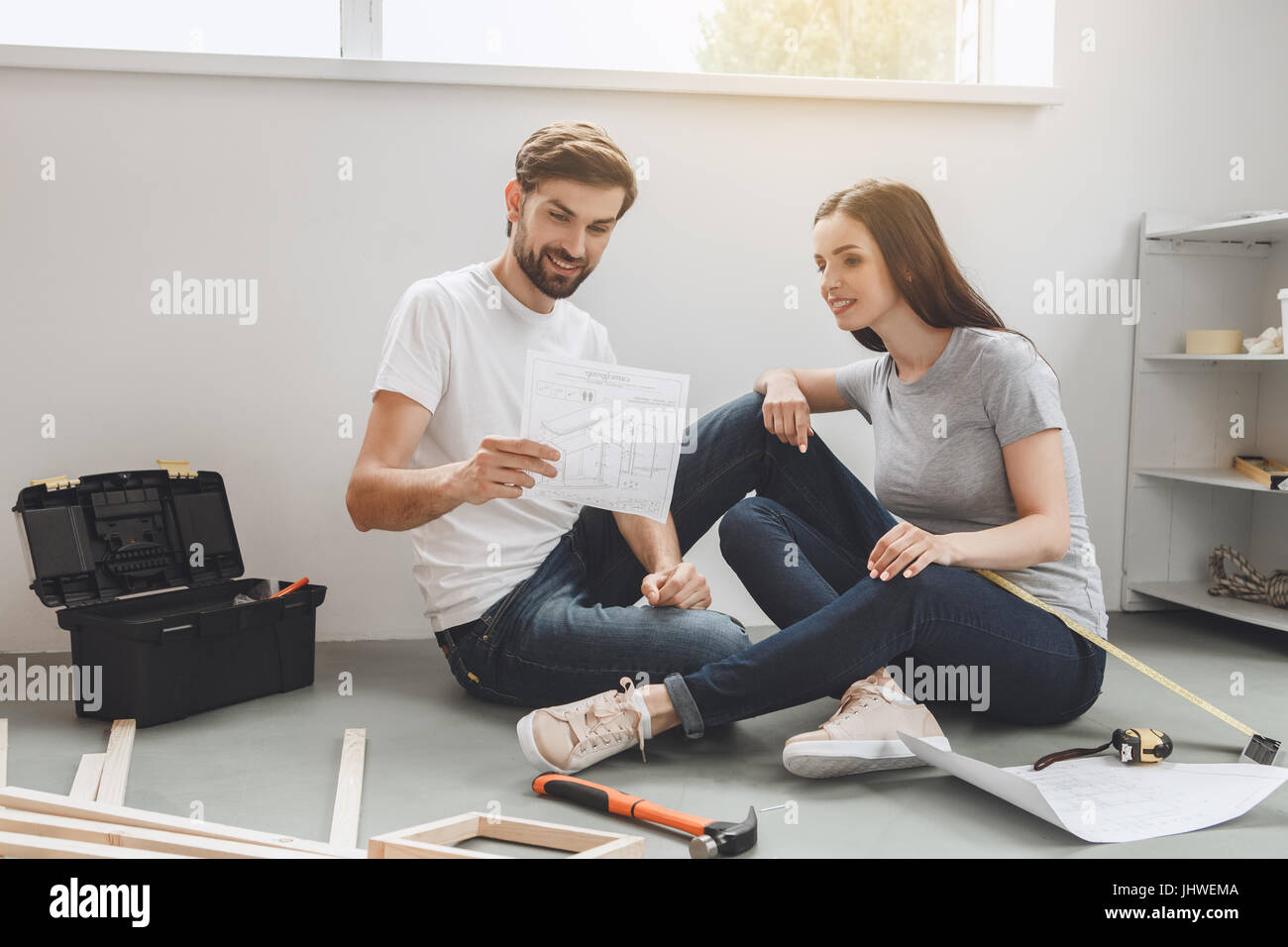 Young couple doing apartment repair together themselves Stock Photo - Alamy