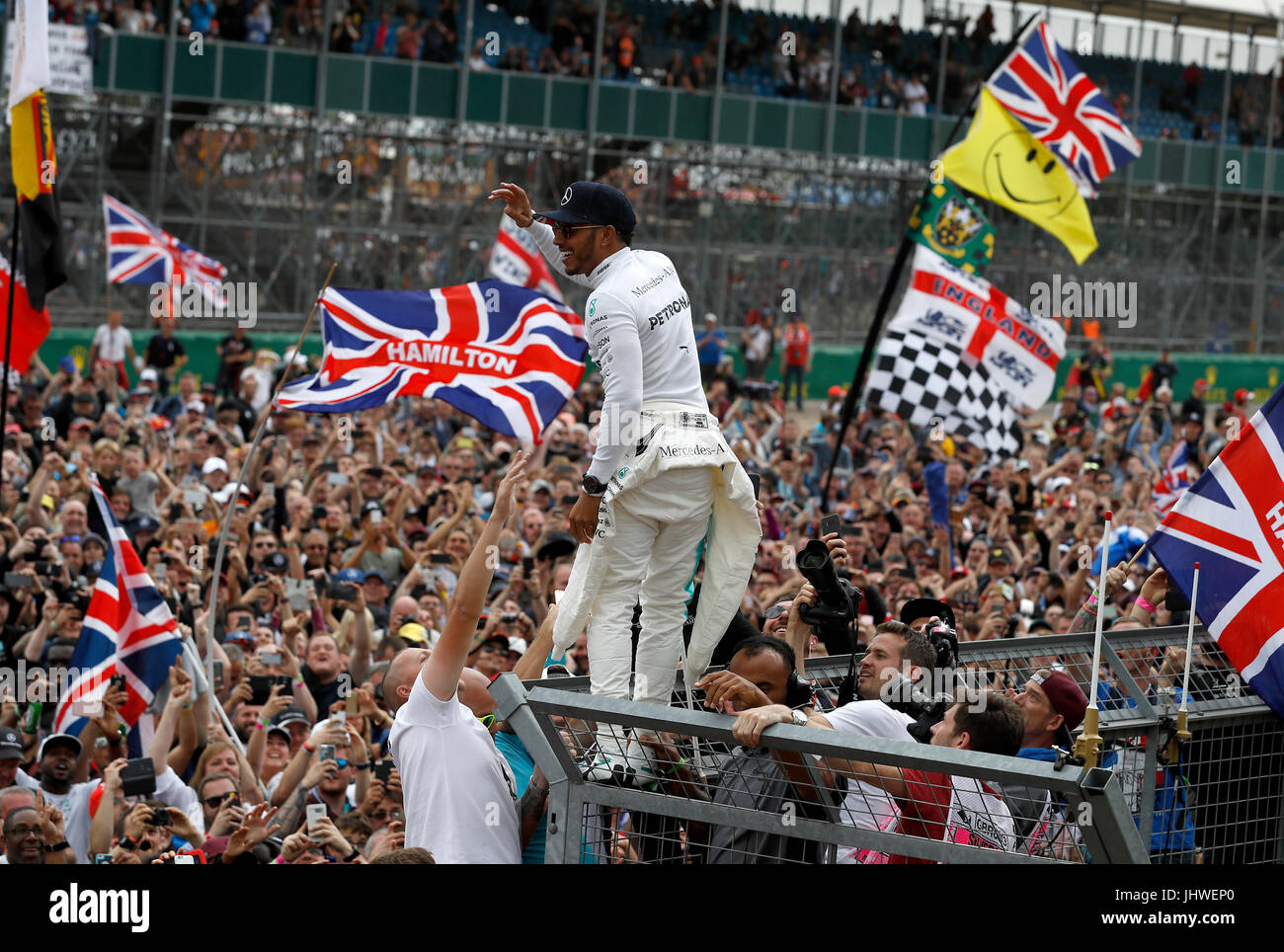 Mercedes' Lewis Hamilton celebrates his victory with the crowd during ...