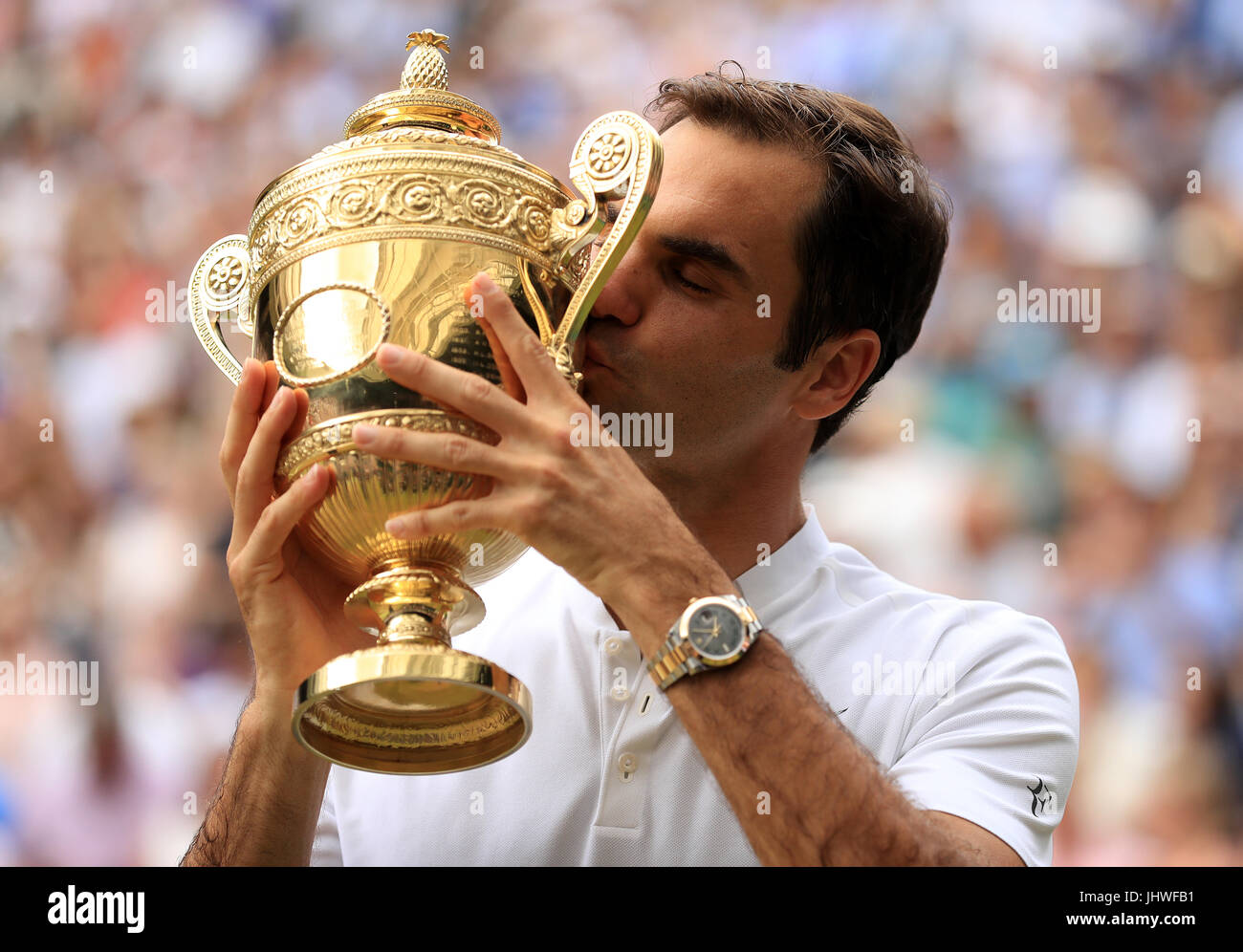 Roger Federer with the trophy after beating Marin Cilic in the ...