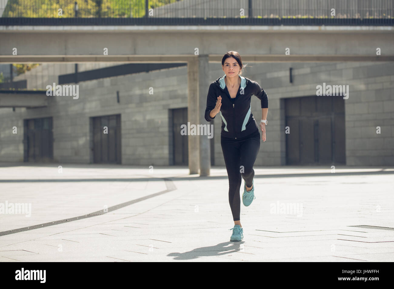Young woman active exercise workout on street outdoor Stock Photo - Alamy
