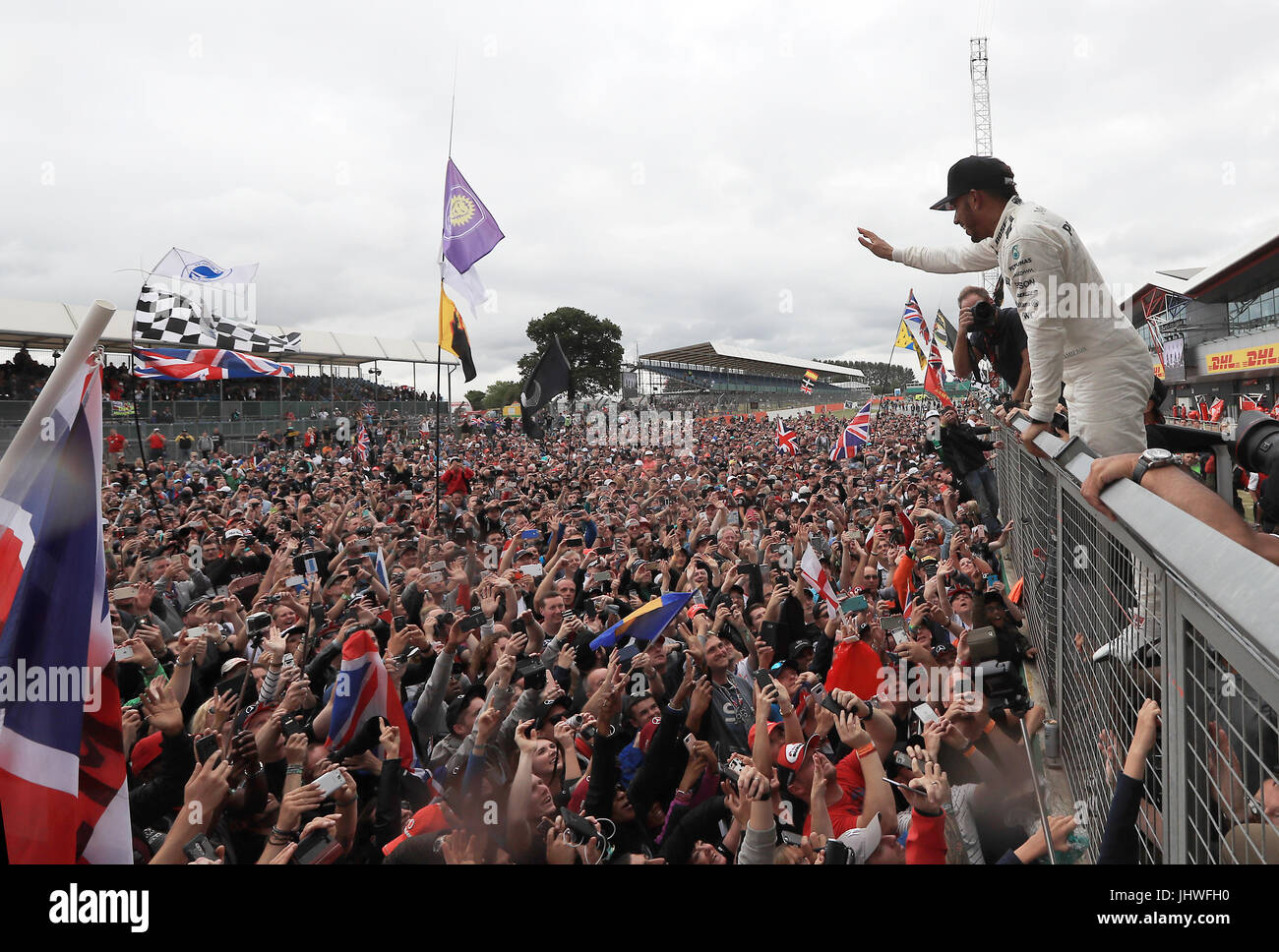 Mercedes' Lewis Hamilton celebrates his victory with the crowd during ...