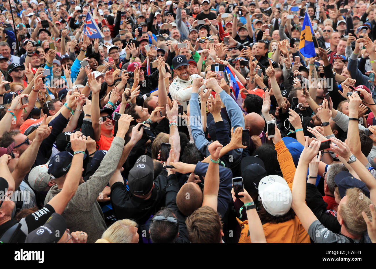 Mercedes' Lewis Hamilton celebrates his victory with the crowd during ...
