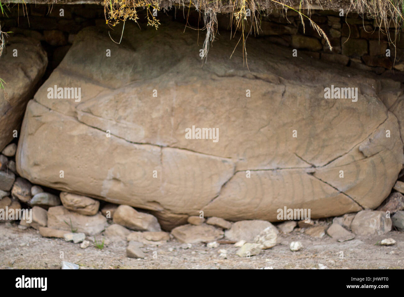 Neolithic art displayed on large stones, Kerbstones with spirals and ...