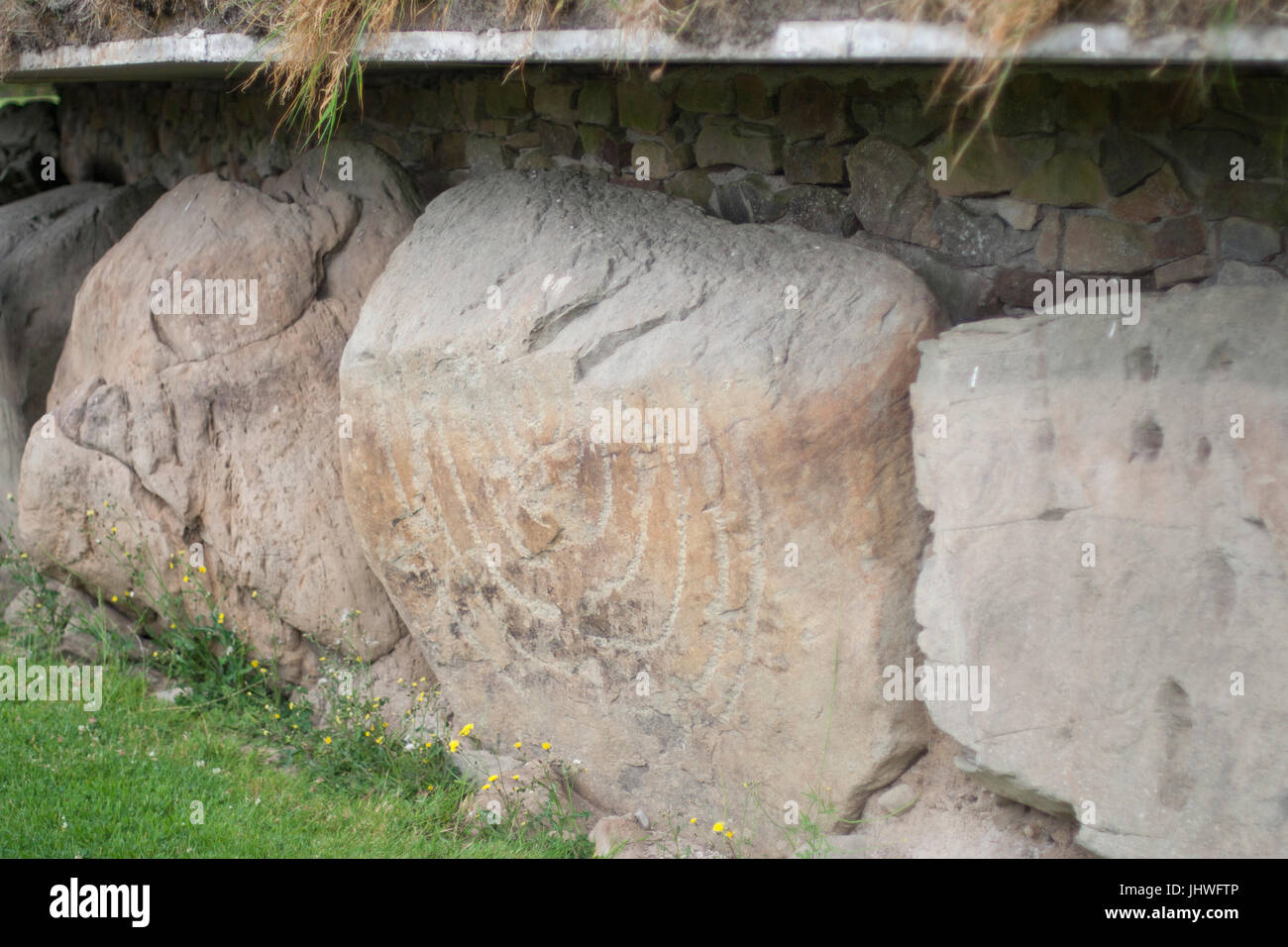 Neolithic art displayed on large stones, Kerbstones with spirals and ...
