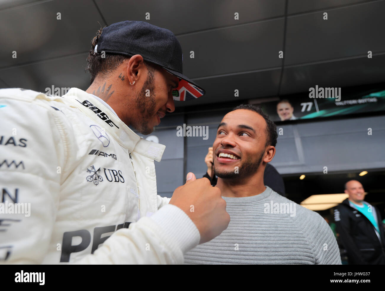 Mercedes' Lewis Hamilton celebrates with his brother Nic after winning ...