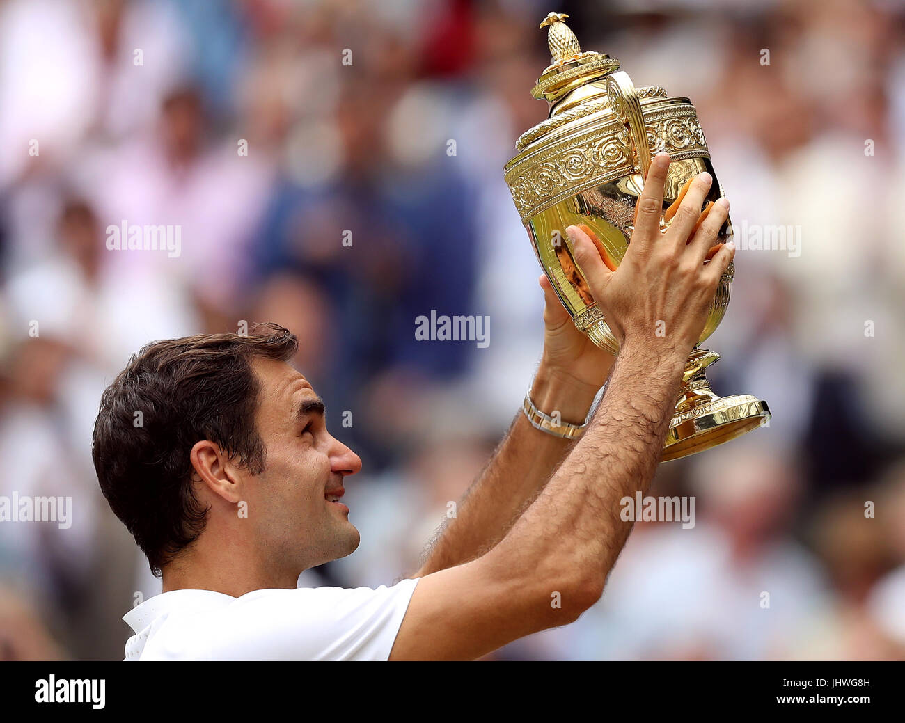 Roger Federer with the trophy after beating Marin Cilic in the ...
