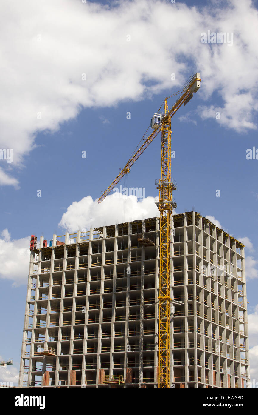 Crane and building construction on sky background Stock Photo - Alamy