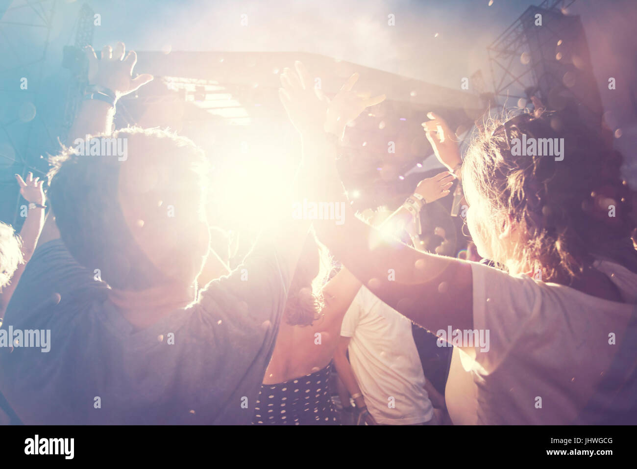 Photo of many people enjoying rock concert, audience applauding to ...