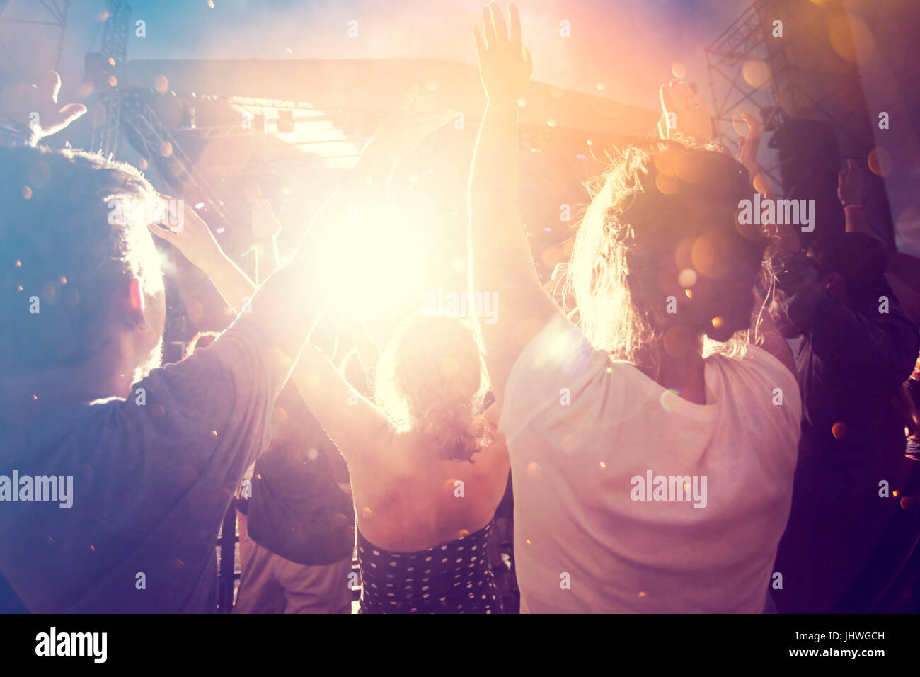Photo of many people enjoying rock concert, audience applauding to ...