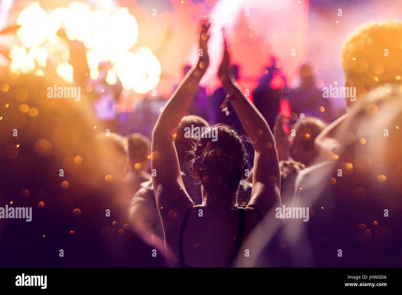 Photo of many people enjoying rock concert, audience applauding to ...