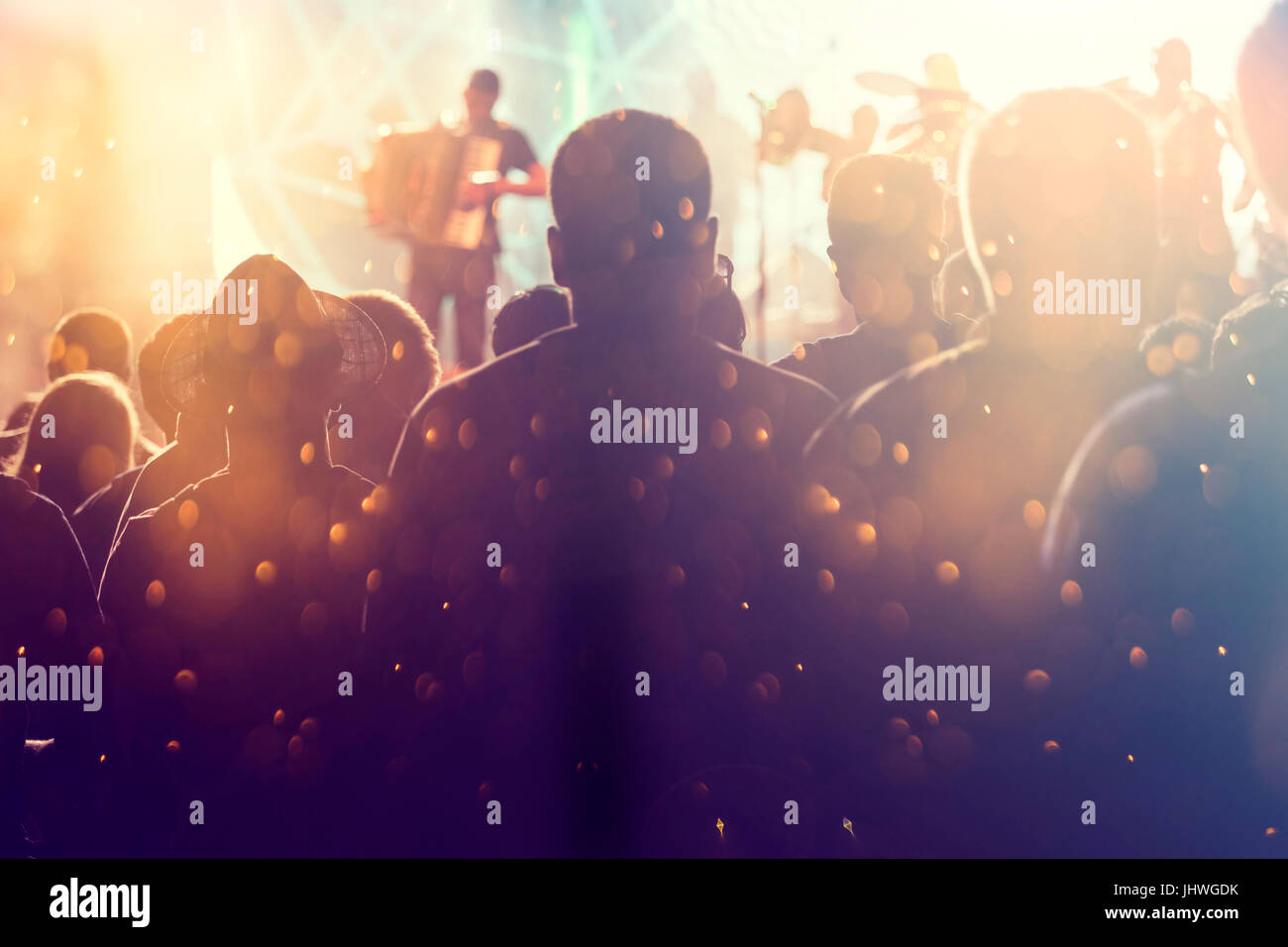 Photo of many people enjoying rock concert, audience applauding to ...