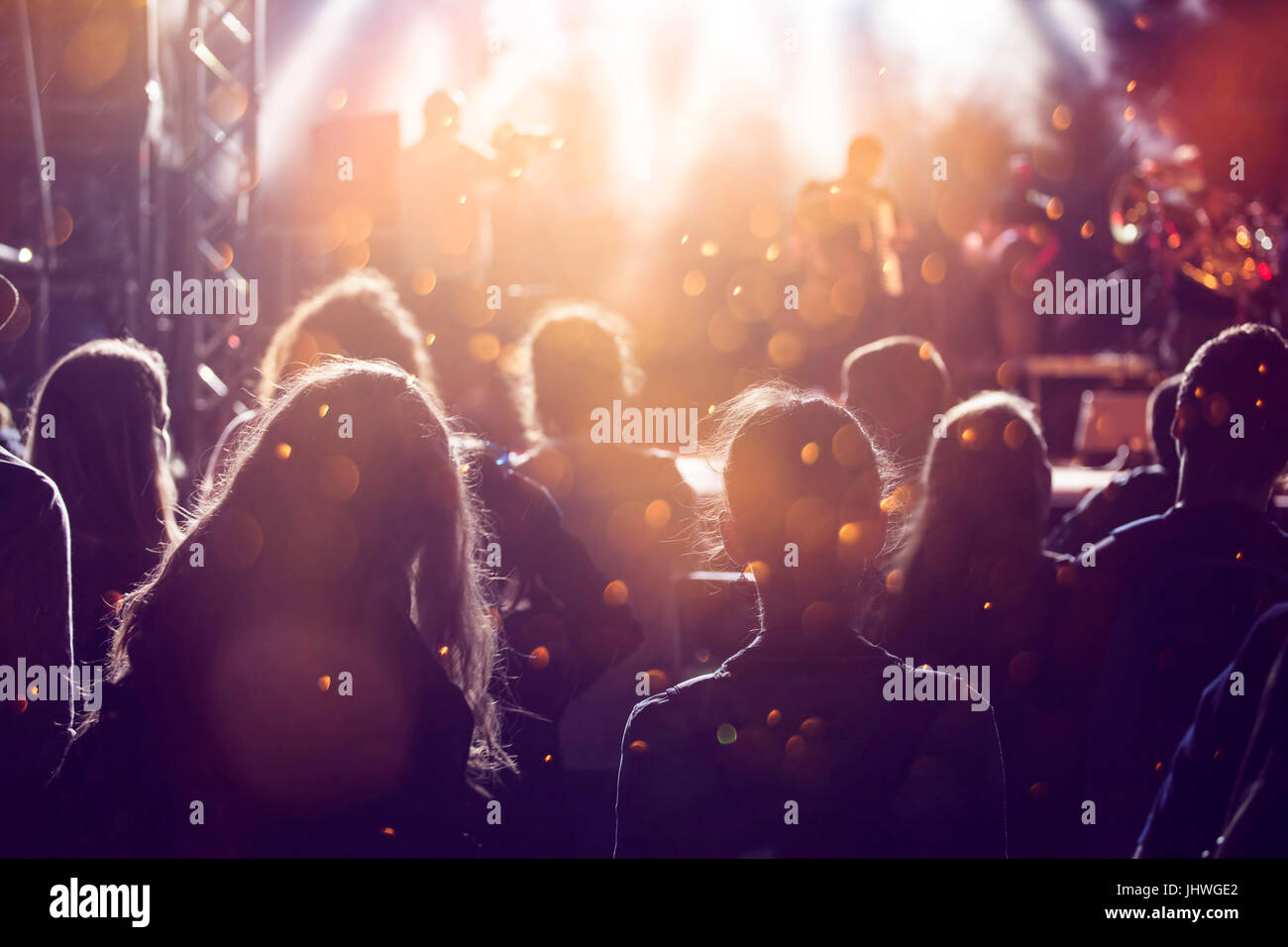 Photo of many people enjoying rock concert, audience applauding to ...