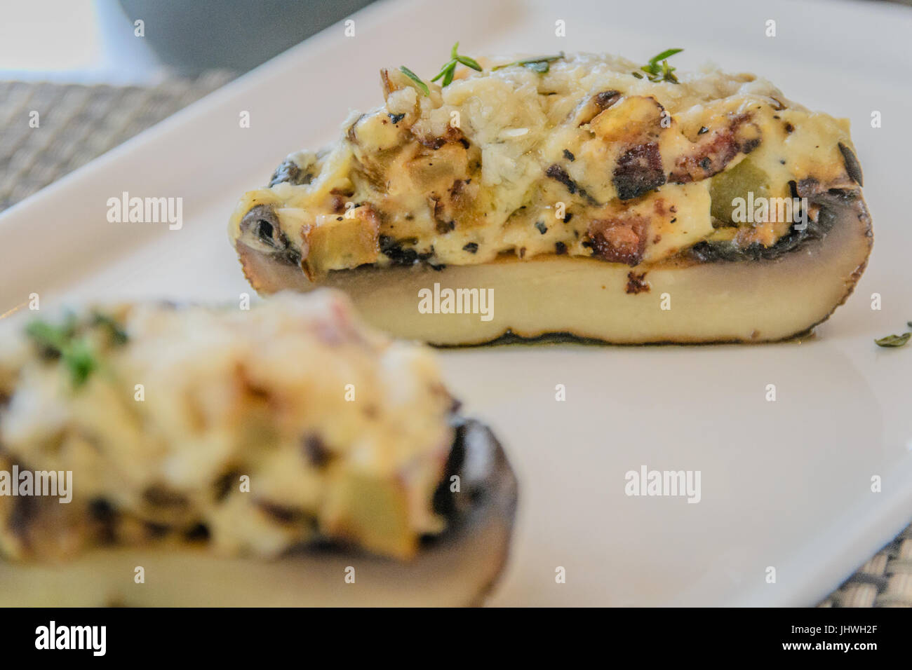 Stuffed Portobello mushrooms served with smoked duck and potato ragout ...