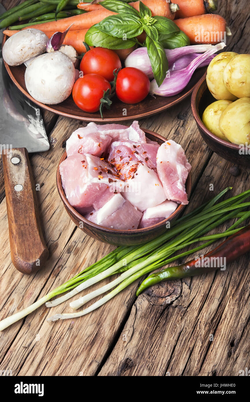Raw meat pork with spices on an old wooden table Stock Photo - Alamy