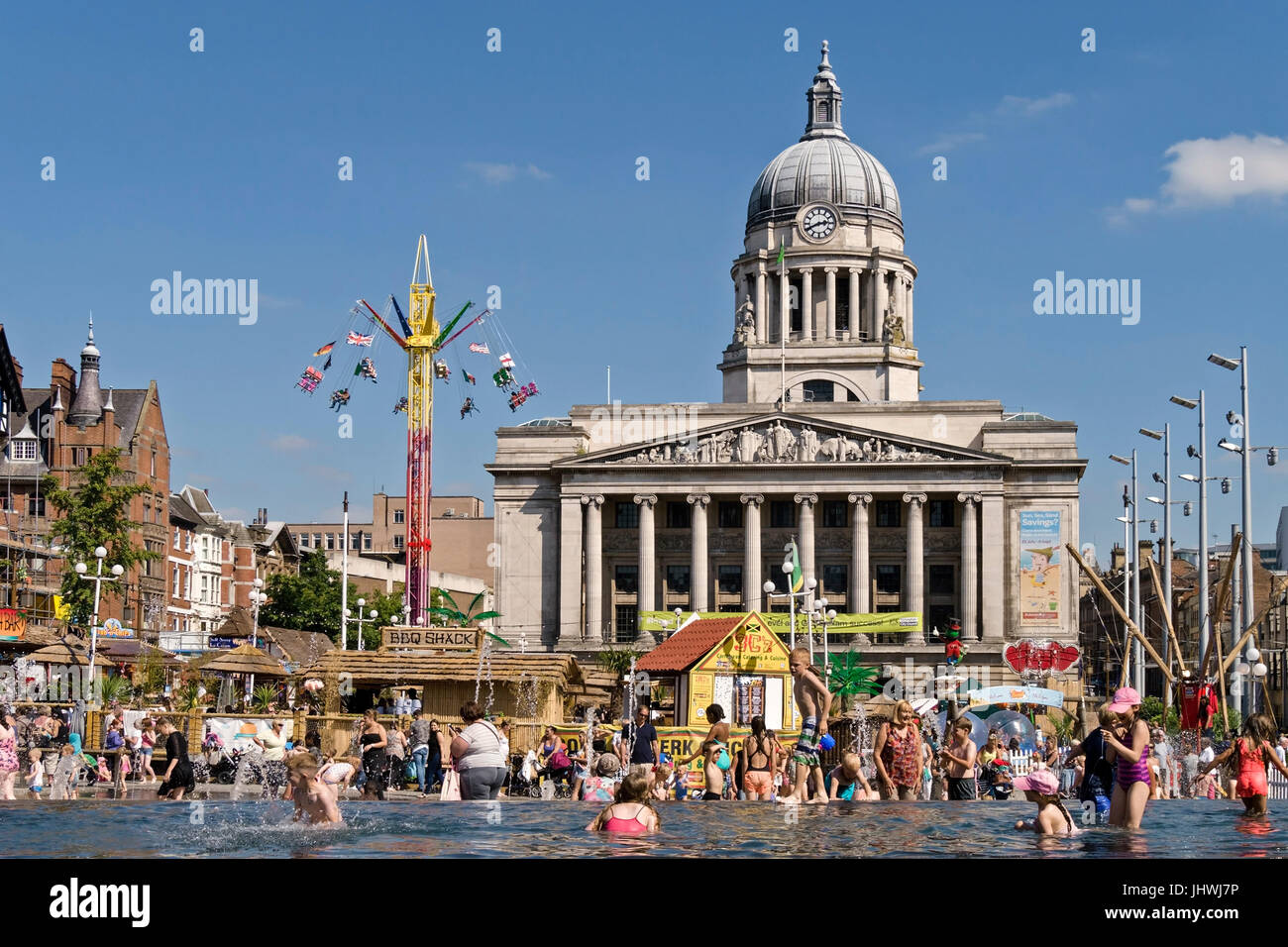 Children playing in water fountains in Old Market Square during ...