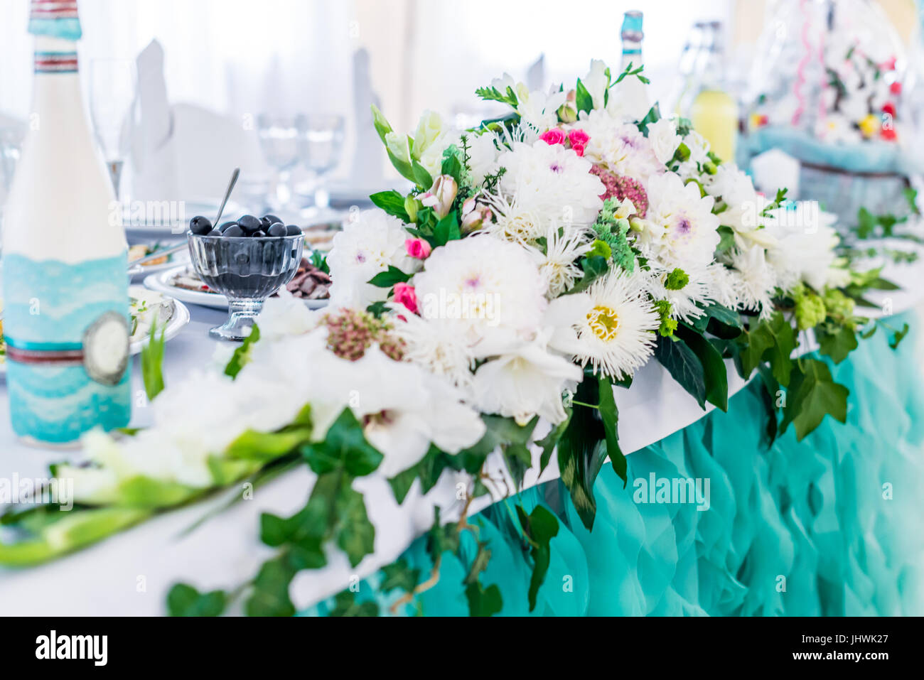 Food table decorated with flowers Stock Photo - Alamy